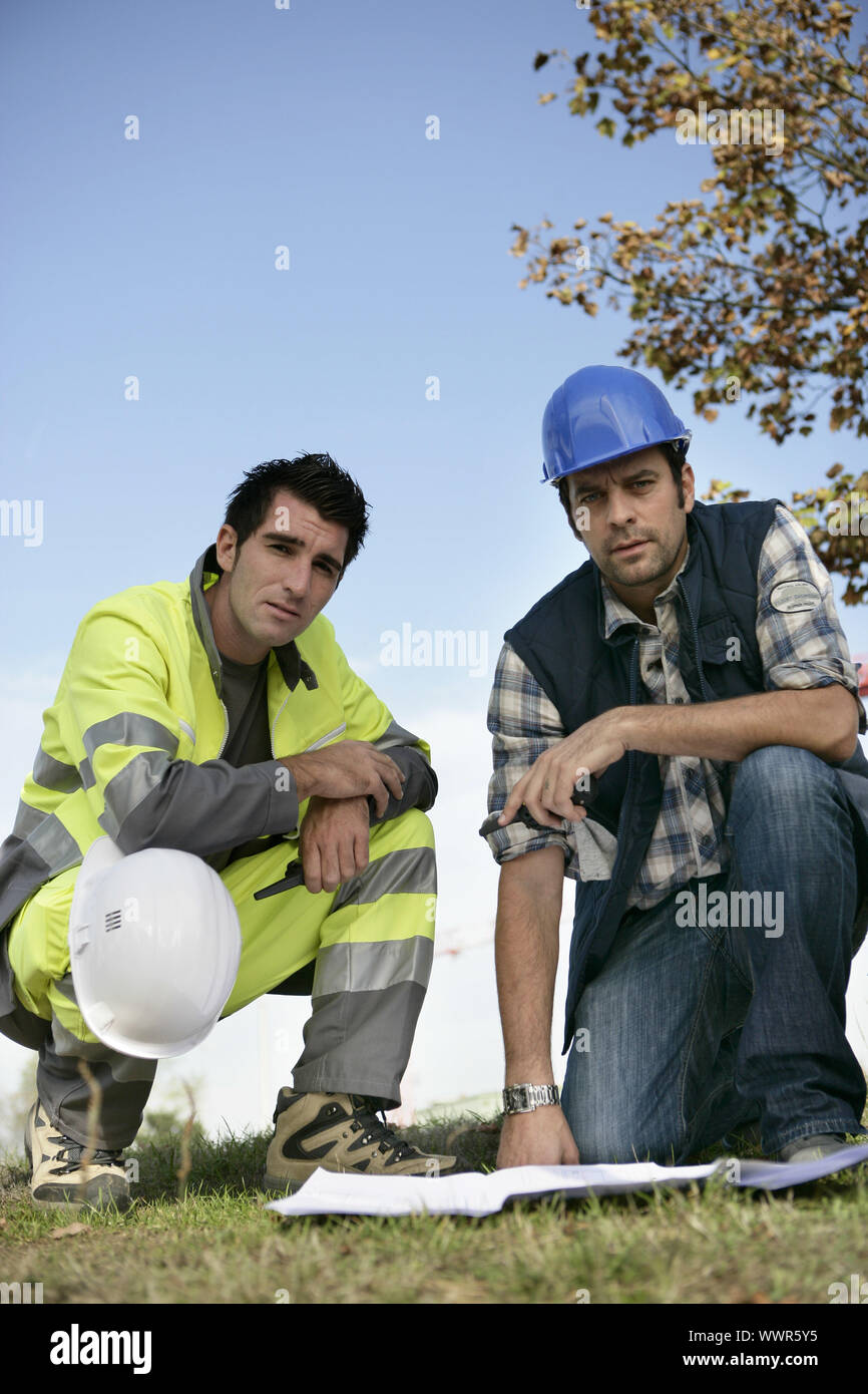 technicians studying a working project Stock Photo - Alamy