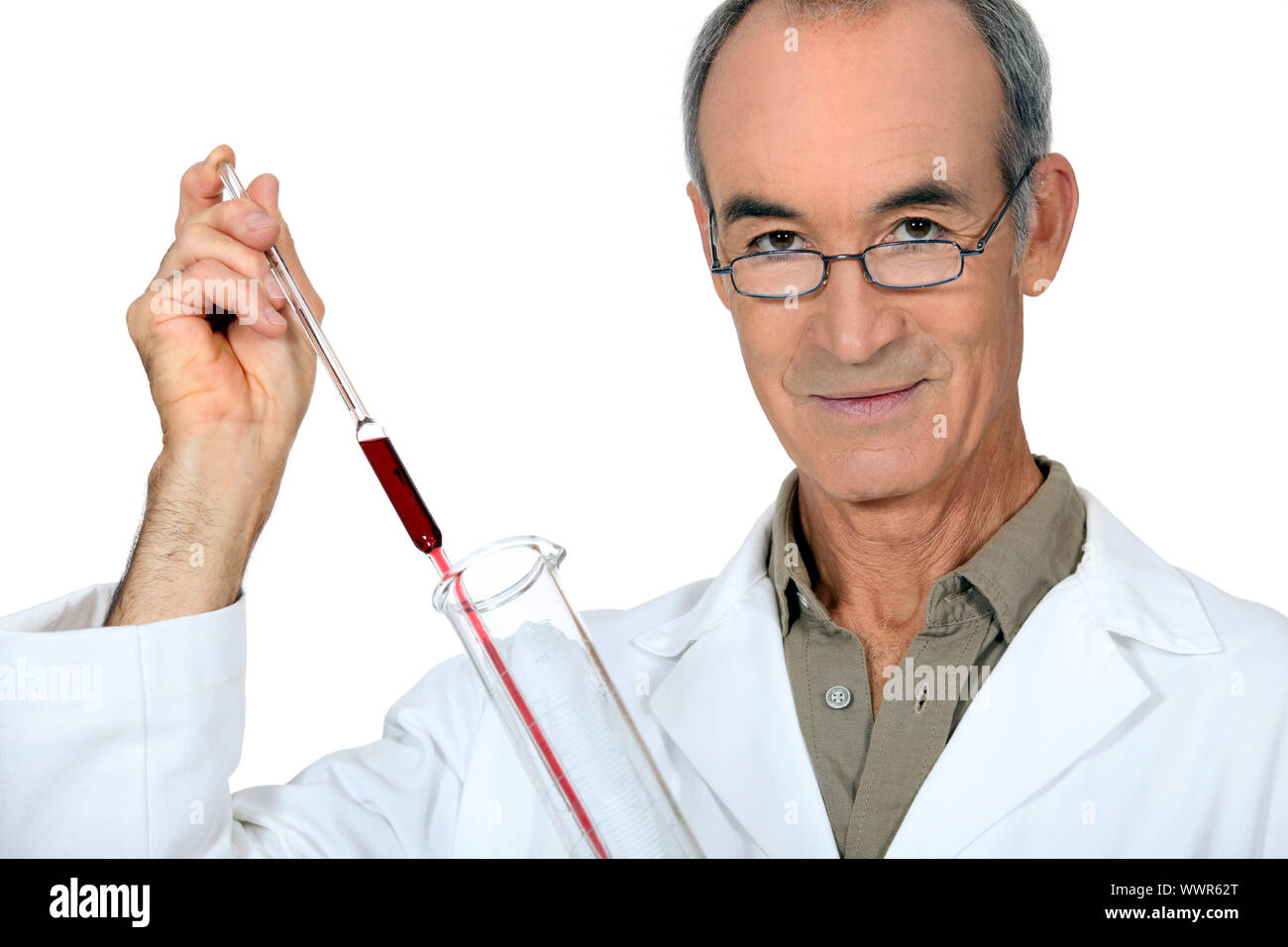 Male scientist conducting experiment Stock Photo - Alamy