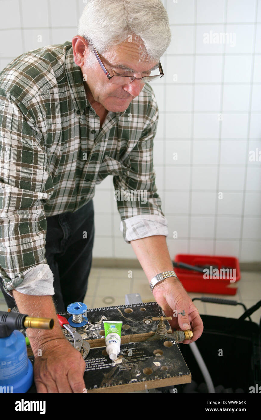 Plumber gluing hi-res stock photography and images - Alamy