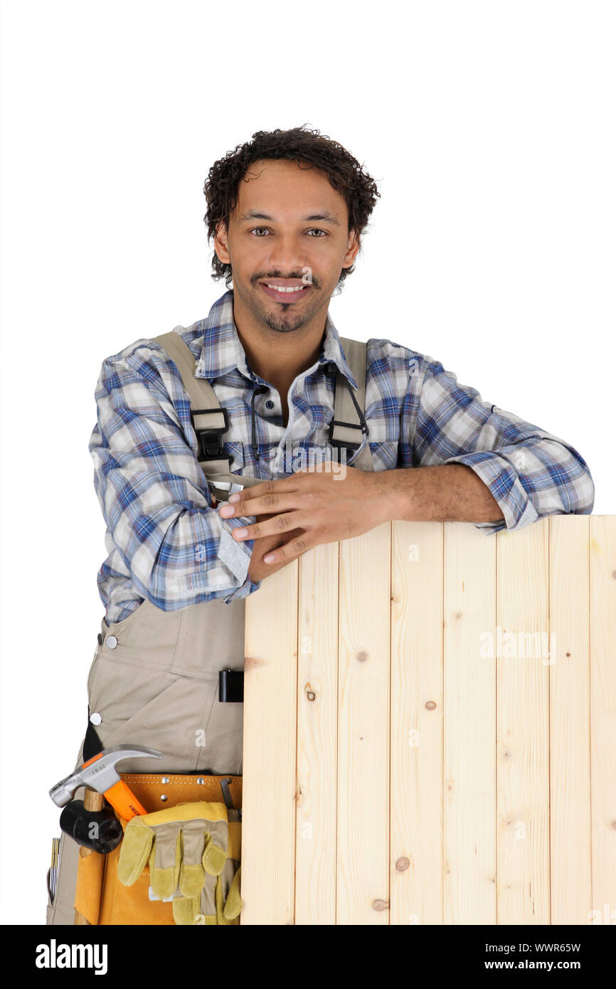 Carpenter with a wooden shutter Stock Photo - Alamy