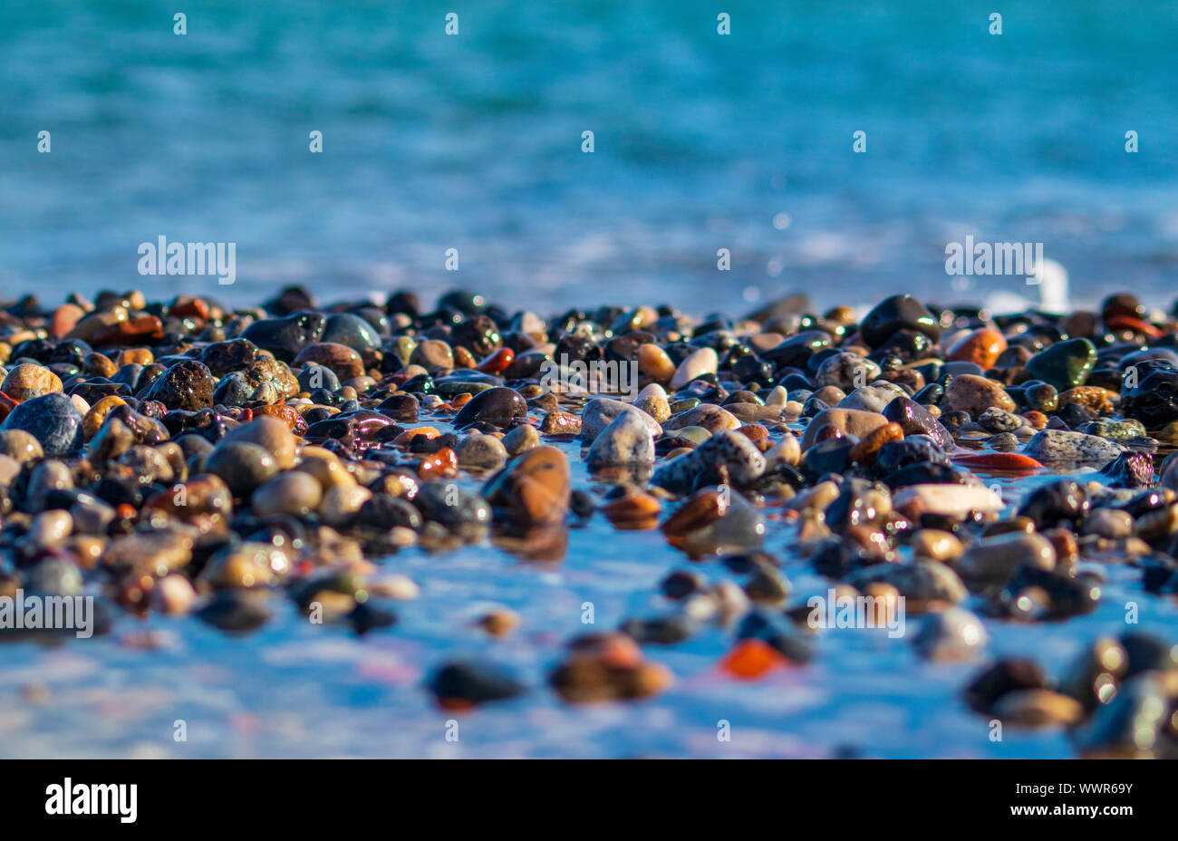 Colored rocks on the beach Stock Photo - Alamy
