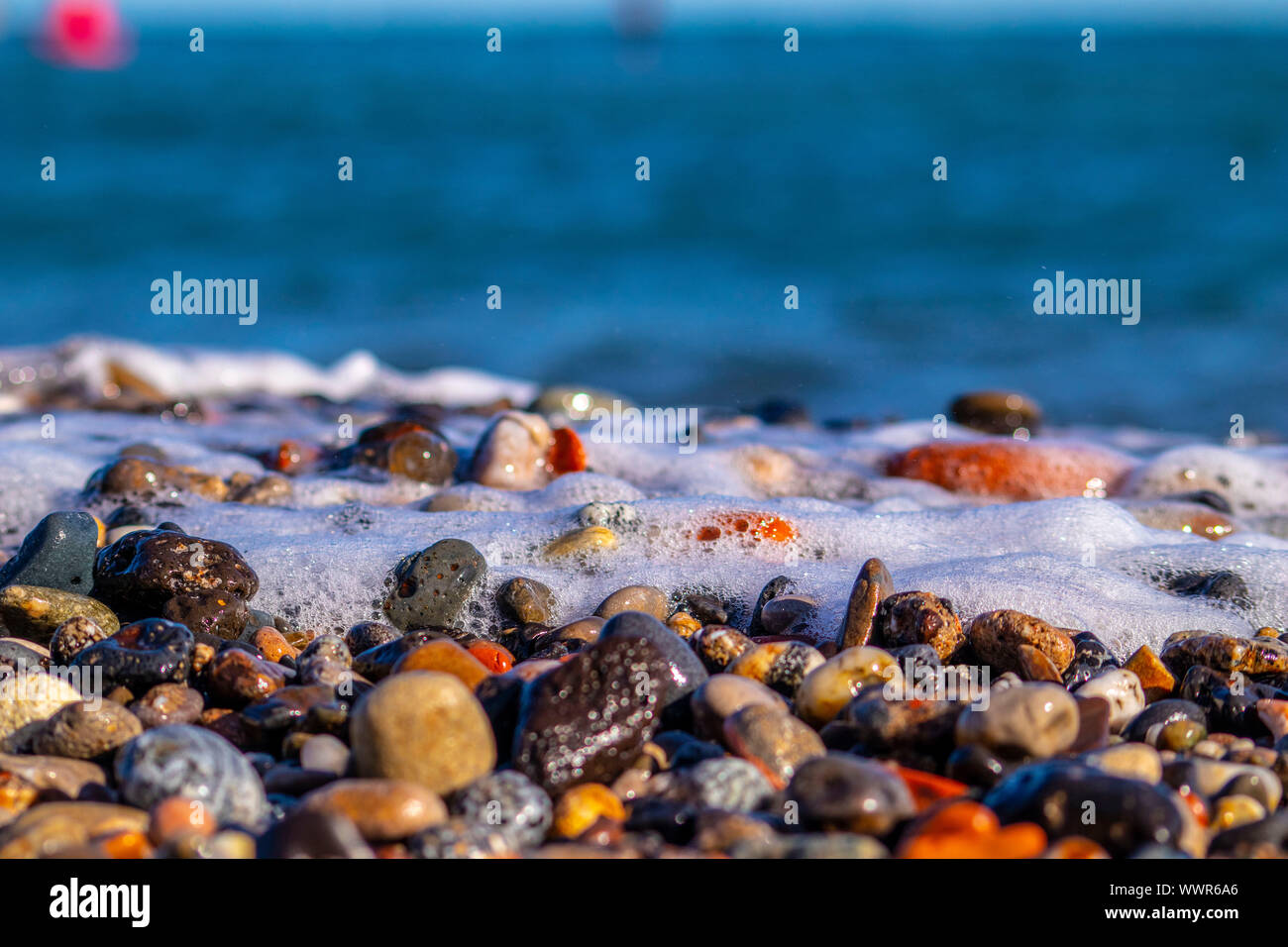 Colored rocks on the beach Stock Photo - Alamy