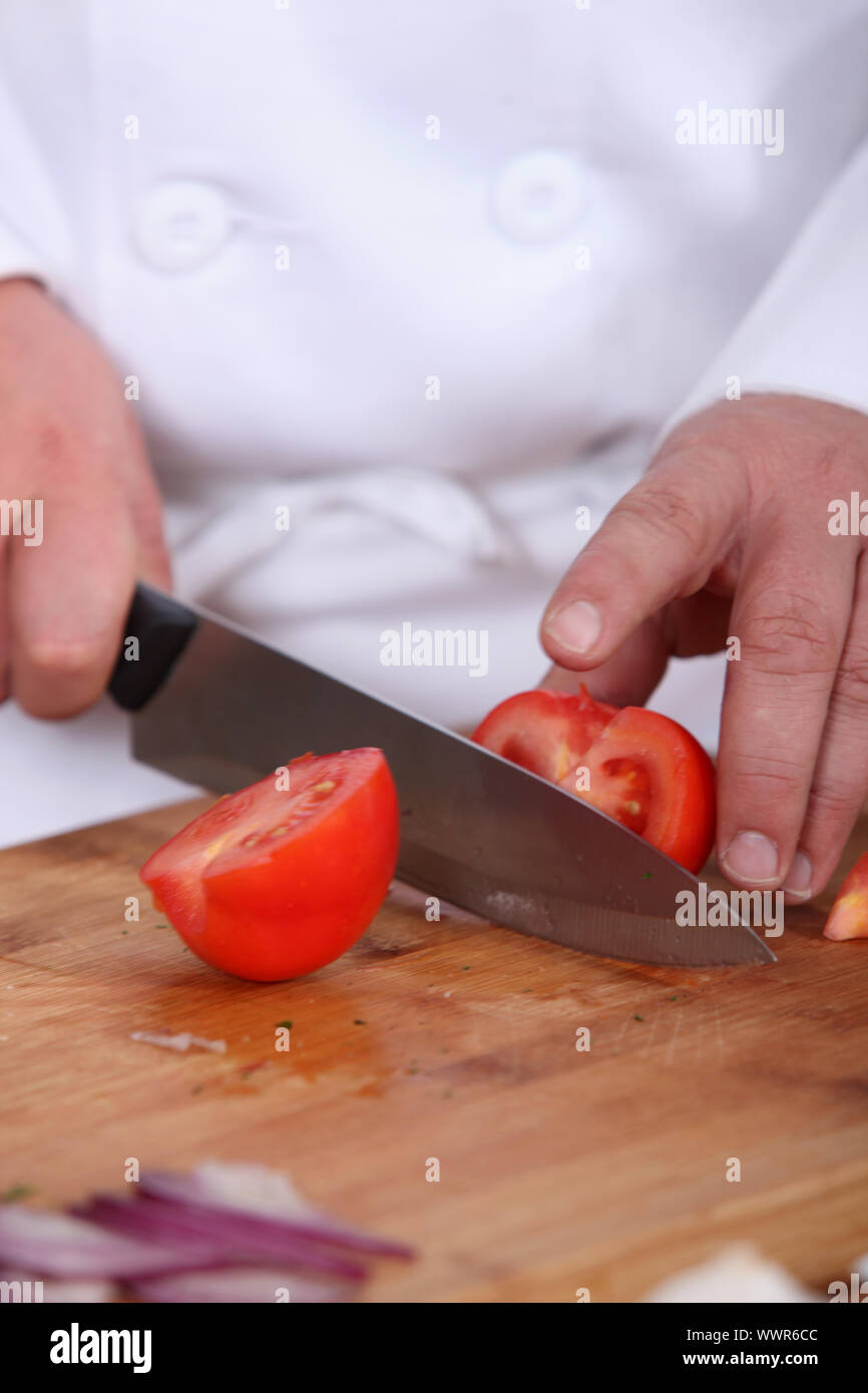 Chef chopping tomato Stock Photo - Alamy