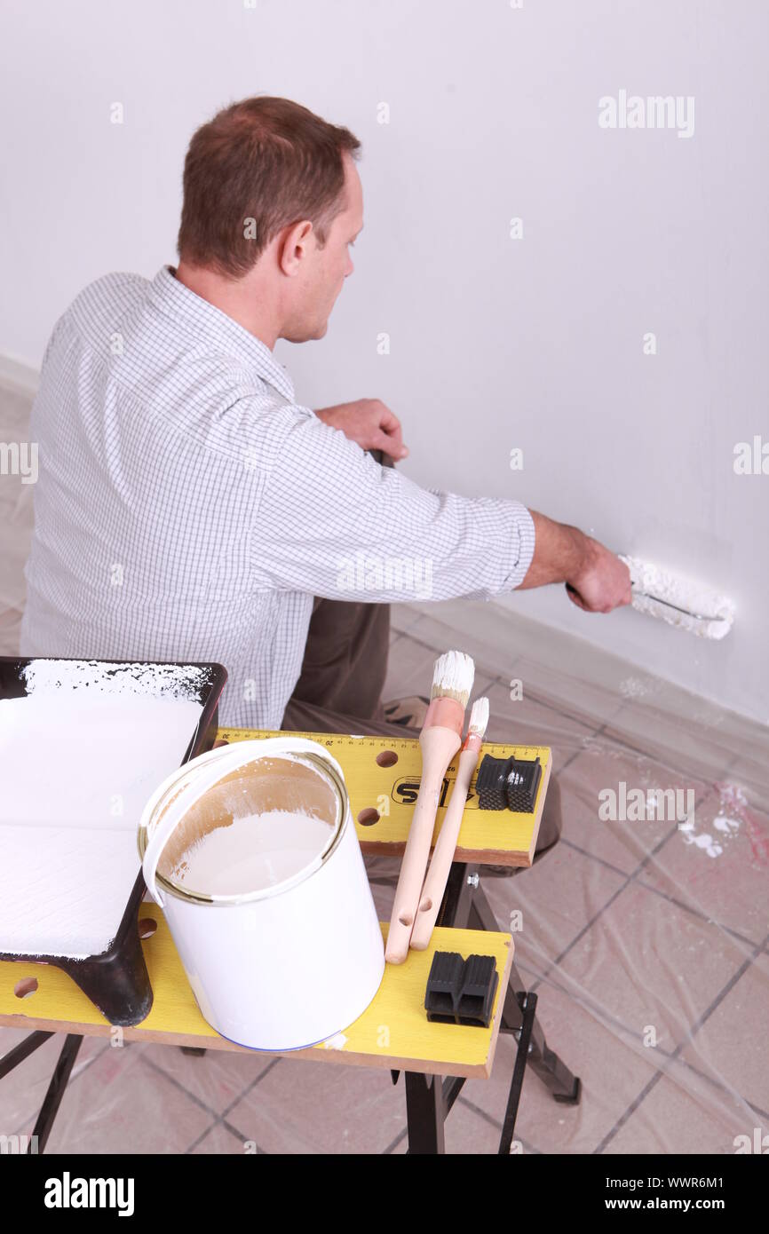 Painter using roller Stock Photo - Alamy