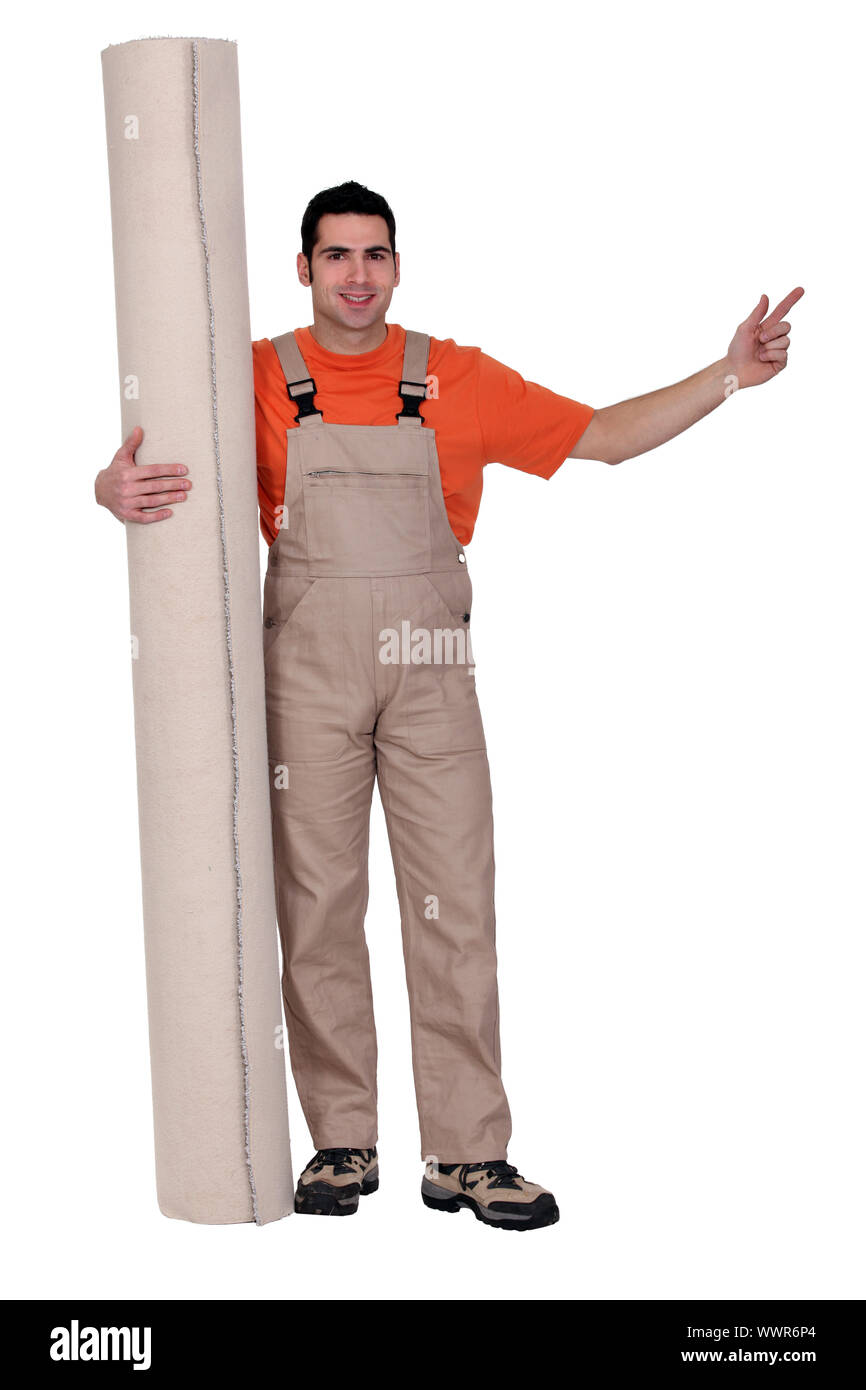 Man with a roll of carpet Stock Photo - Alamy