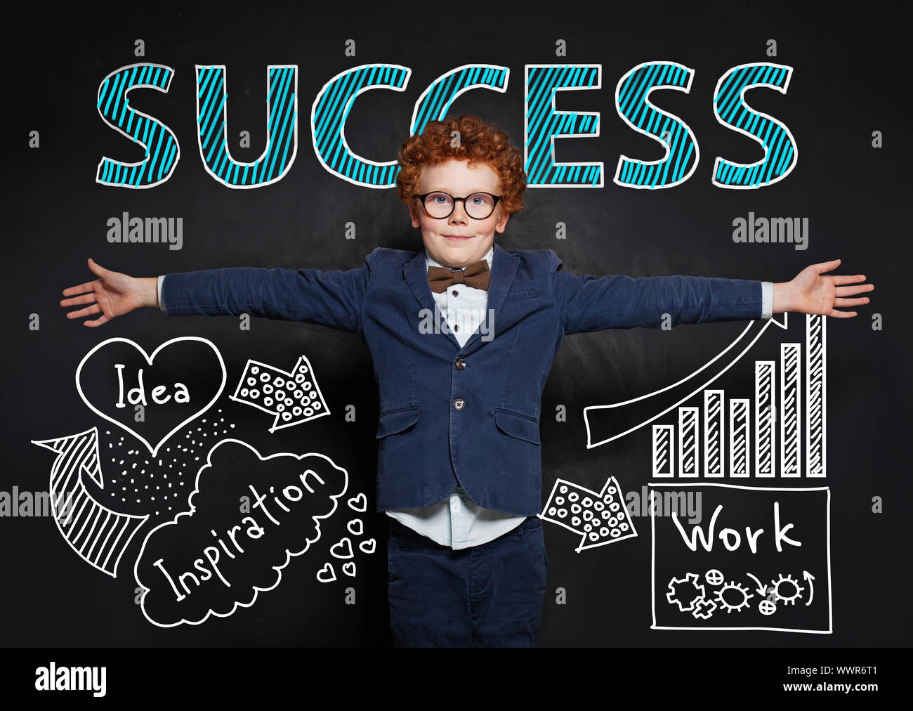 Young boy in blue suit against success concept Stock Photo - Alamy