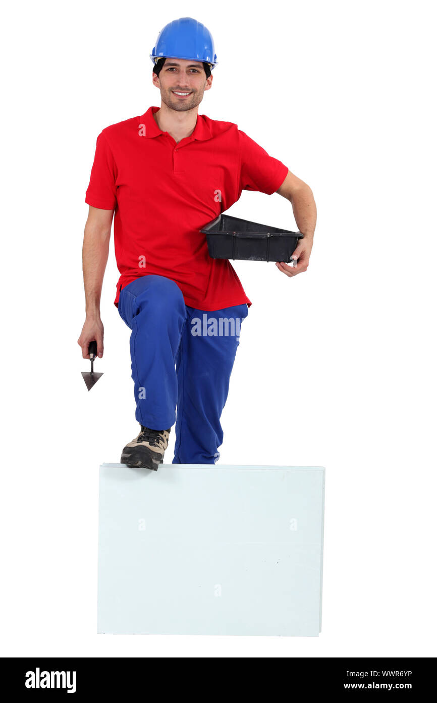 Workman with a board left blank for your message Stock Photo - Alamy