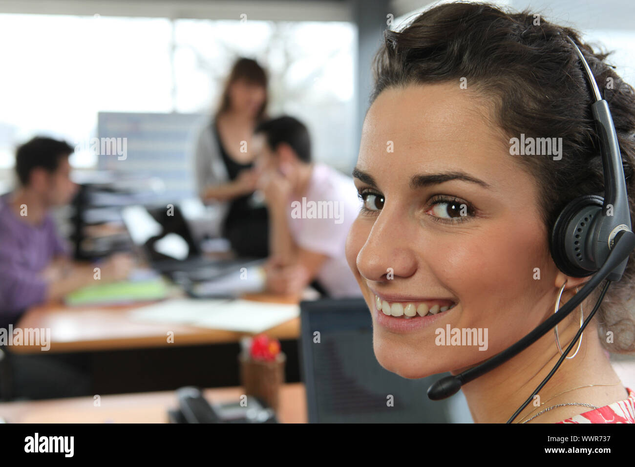 Woman wearing a telephone headset Stock Photo - Alamy