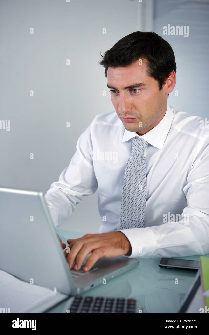 Banker sat desk hi-res stock photography and images - Alamy