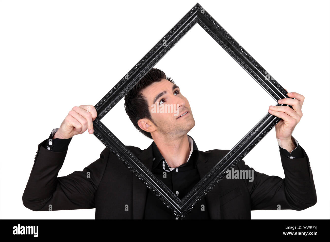 a man looking a wooden frame Stock Photo - Alamy