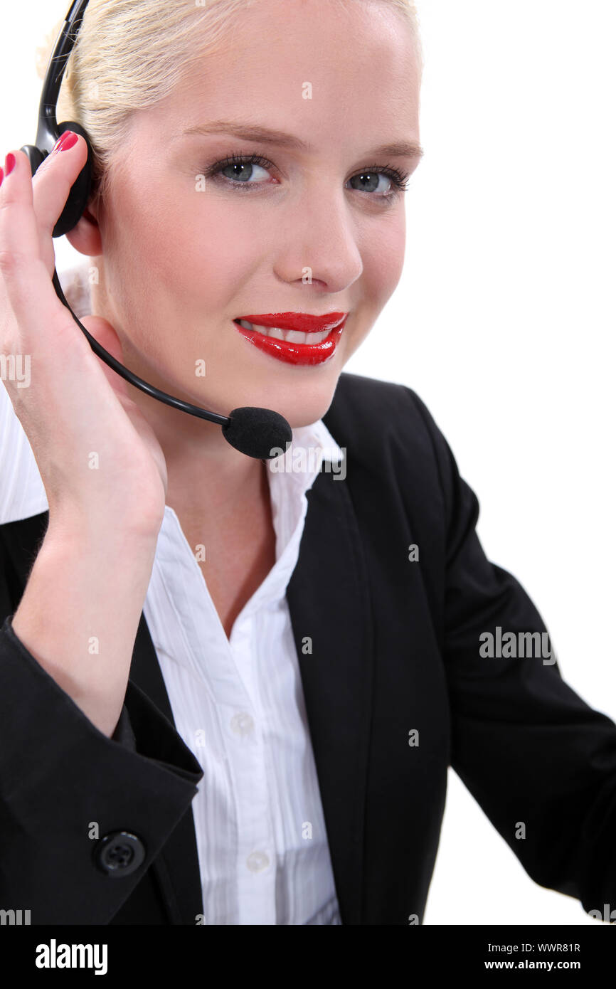 Fair-skinned woman wearing a headset Stock Photo - Alamy