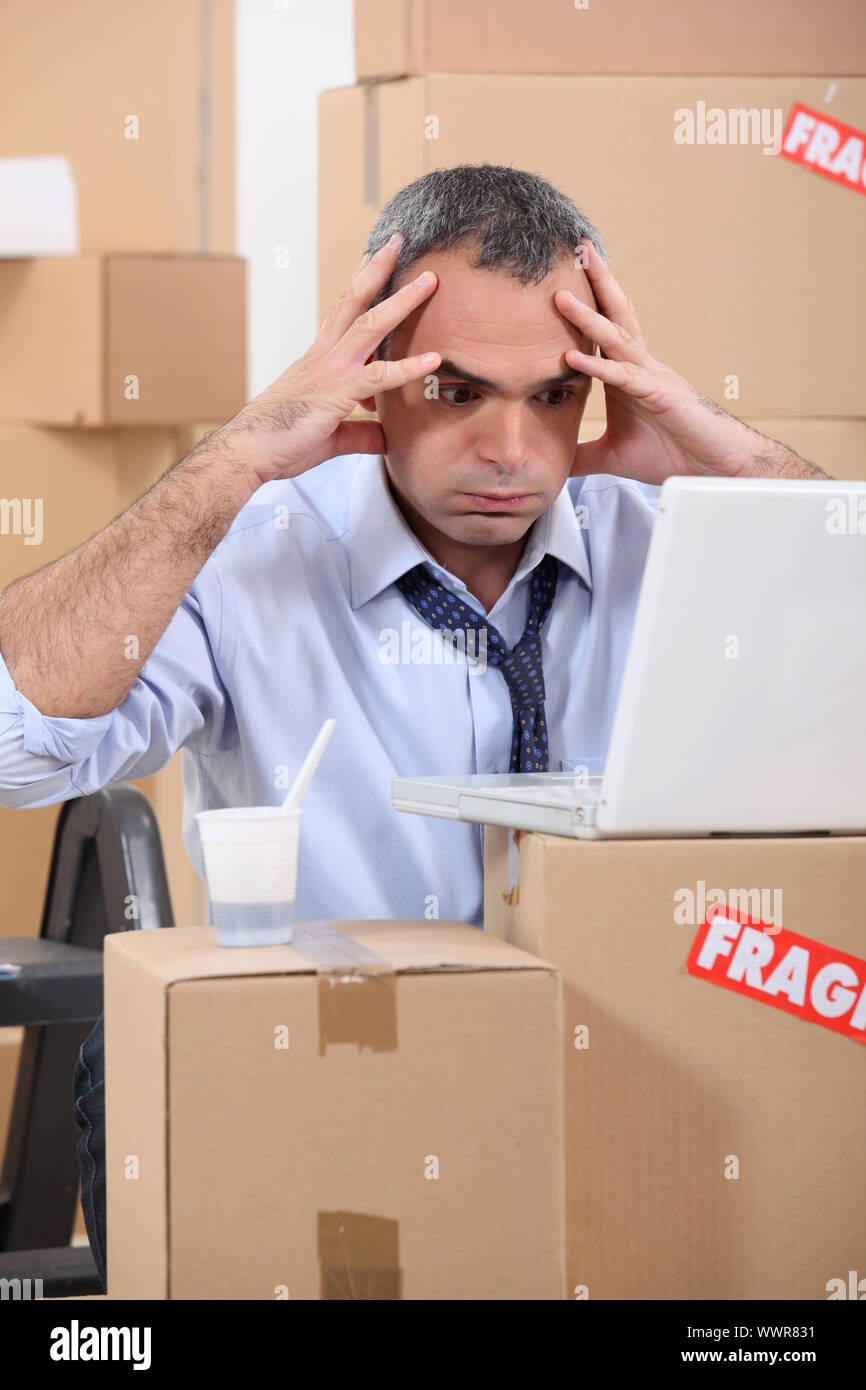 Man facing a logistical nightmare Stock Photo - Alamy
