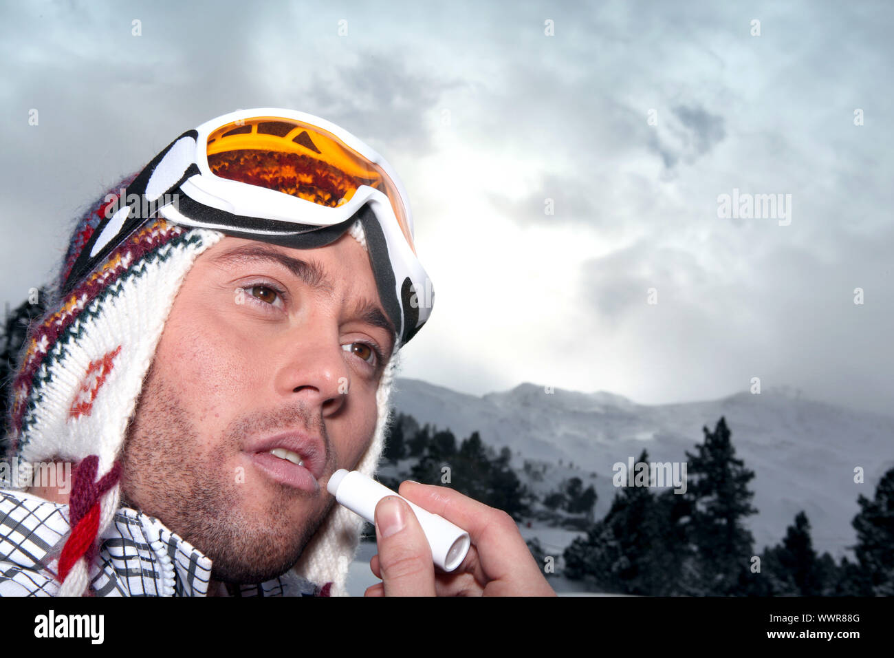 Man applying sunblock to lips Stock Photo - Alamy