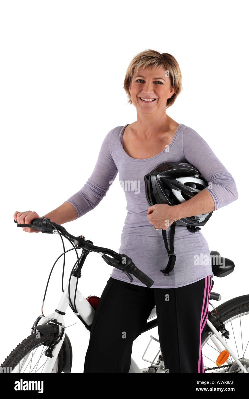 Blonde all smiles with bike Stock Photo - Alamy