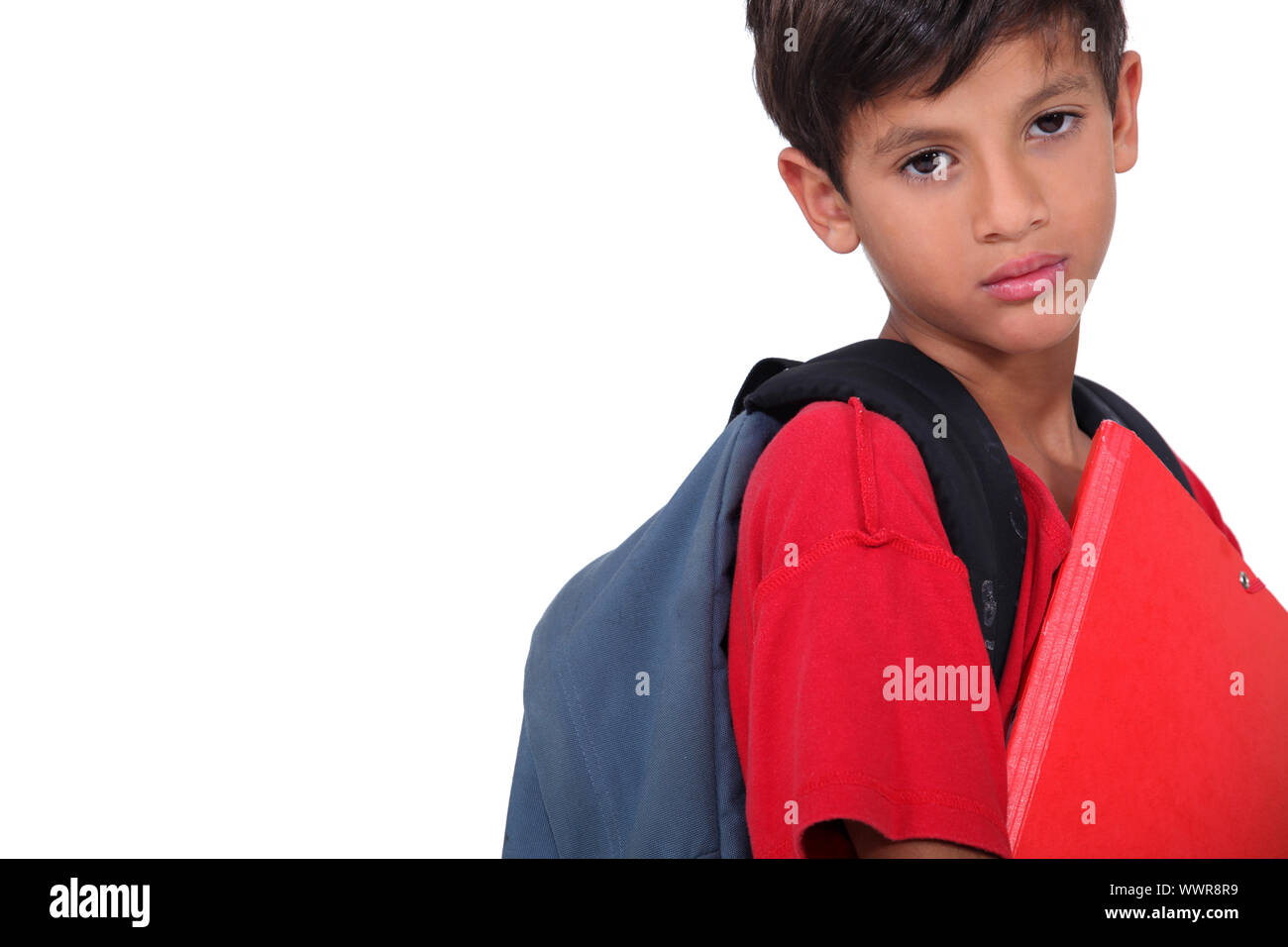 Sulky looking schoolboy Stock Photo - Alamy