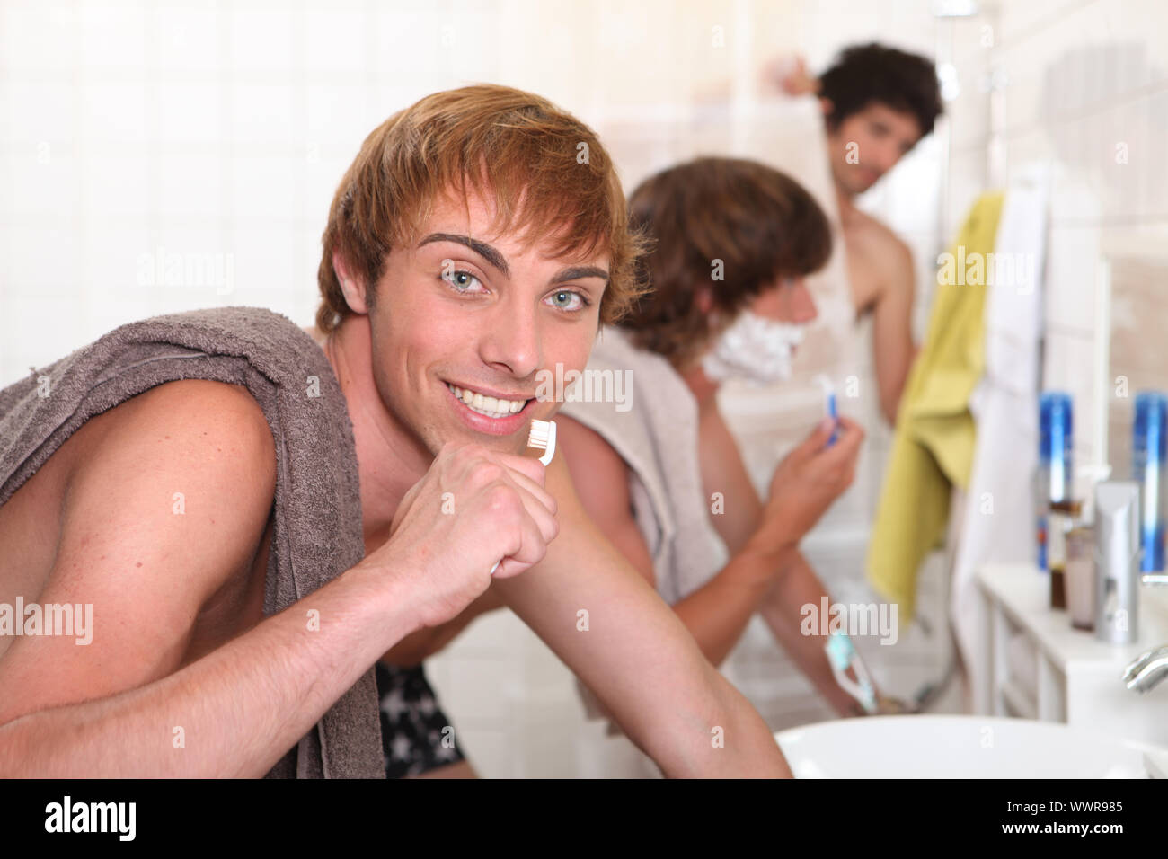 Guys in the bathroom Stock Photo - Alamy