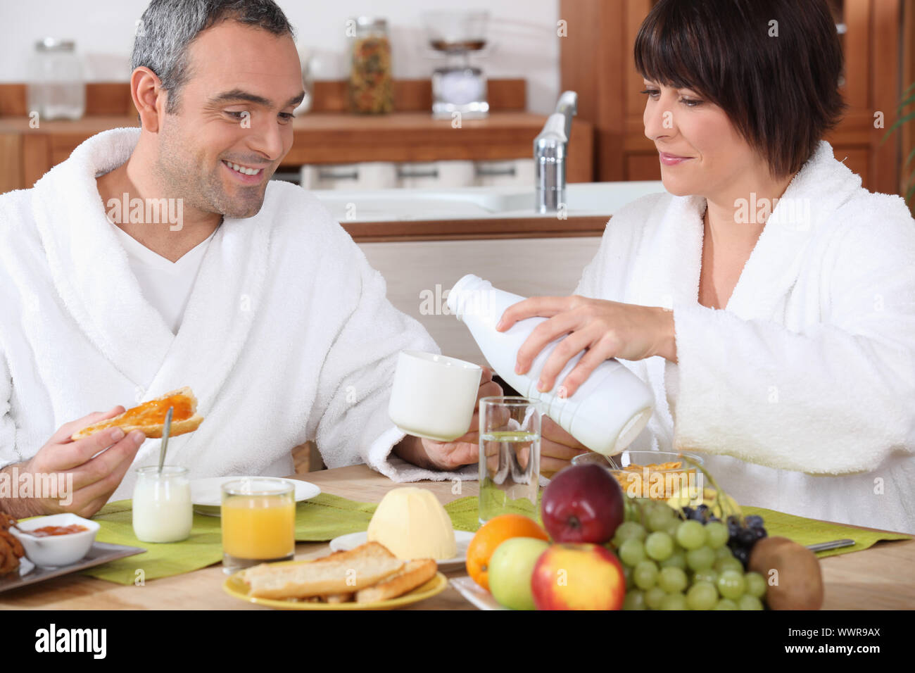 Couple having breakfast together Stock Photo - Alamy
