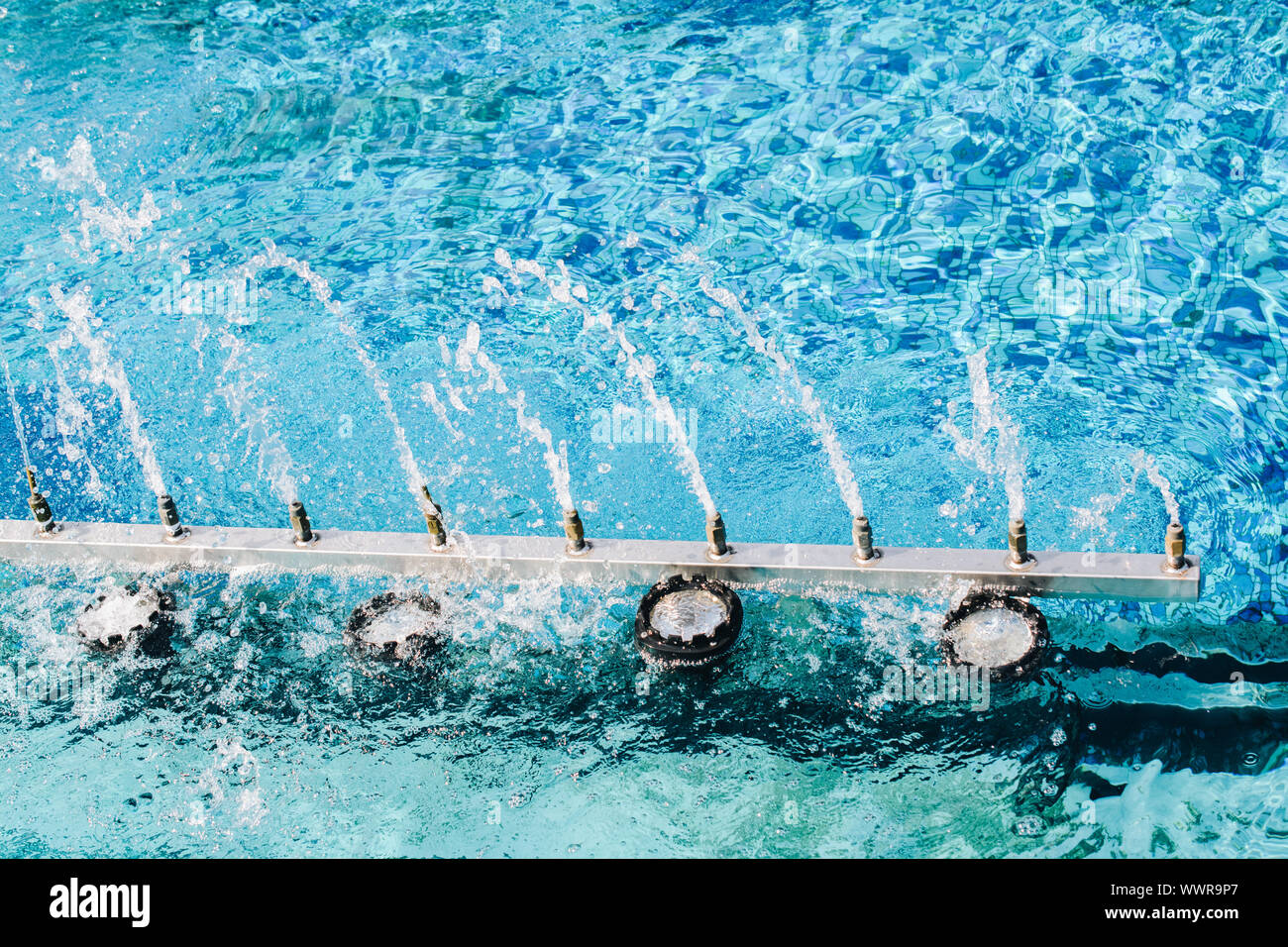 A water fountain sprinkling water in the view Stock Photo - Alamy