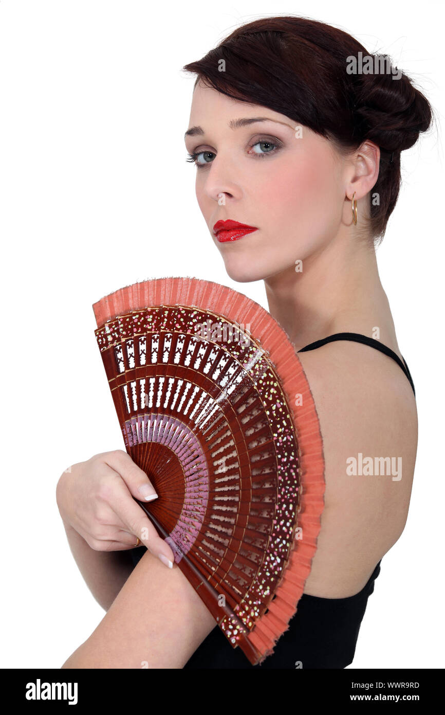 Spanish dancer holding a fan Stock Photo - Alamy