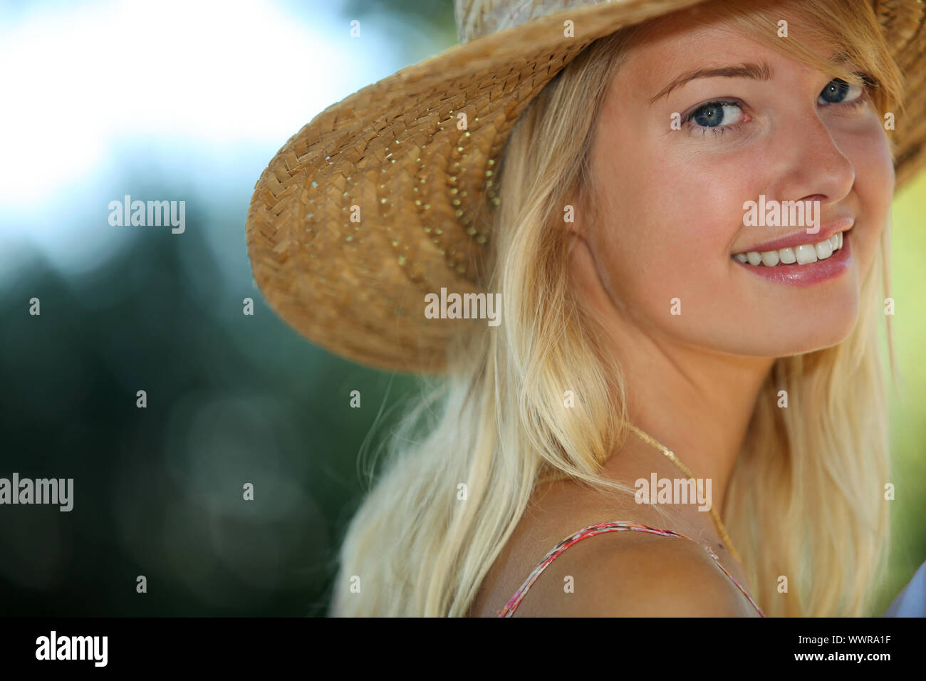 Portrait of a sun-kissed young woman Stock Photo - Alamy