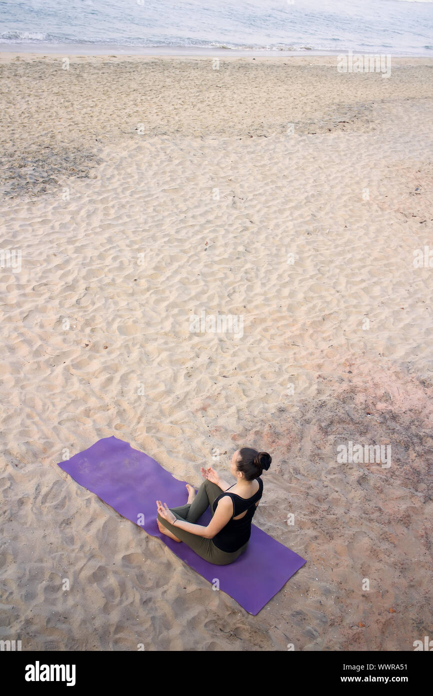training yoga on the beach of the Indian ocean Stock Photo - Alamy