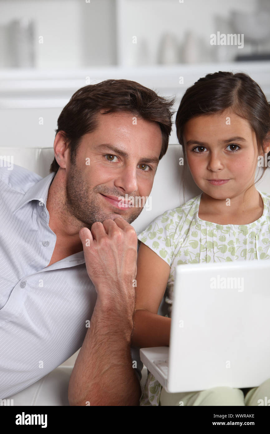 Father and daughter on laptop Stock Photo - Alamy