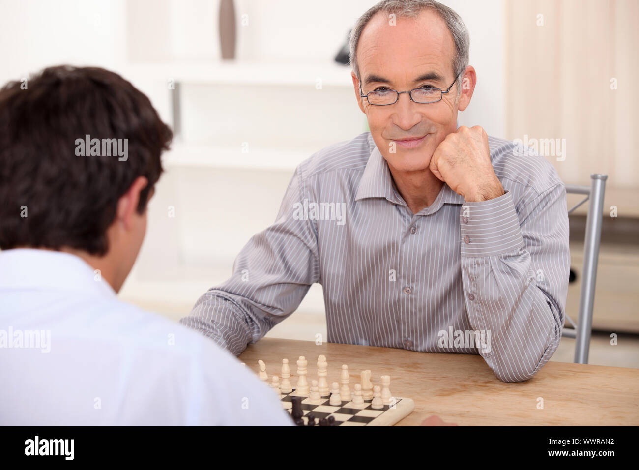 Grandfather grandson play chess hi-res stock photography and images - Alamy