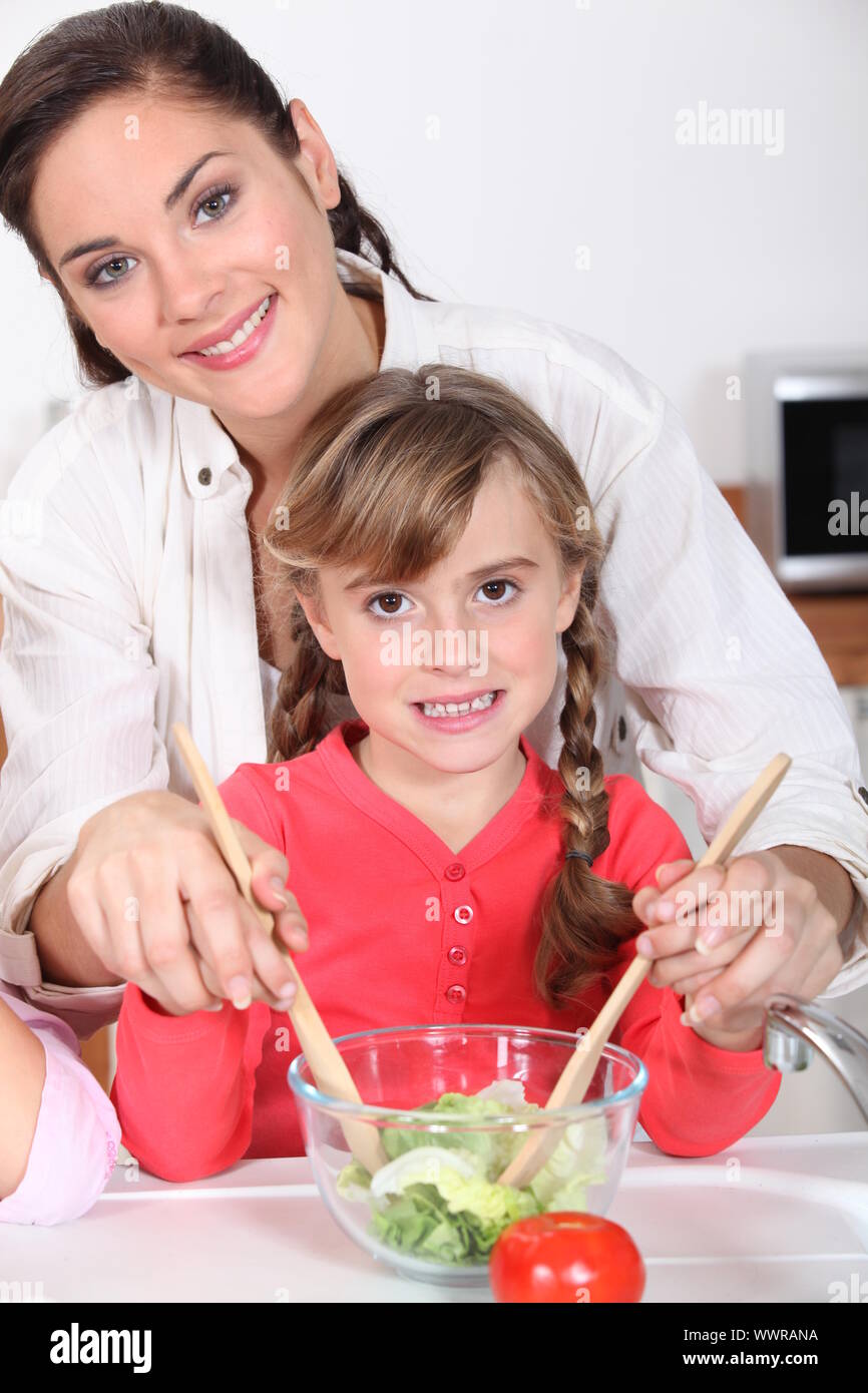 Mother and daughter cooking together Stock Photo - Alamy