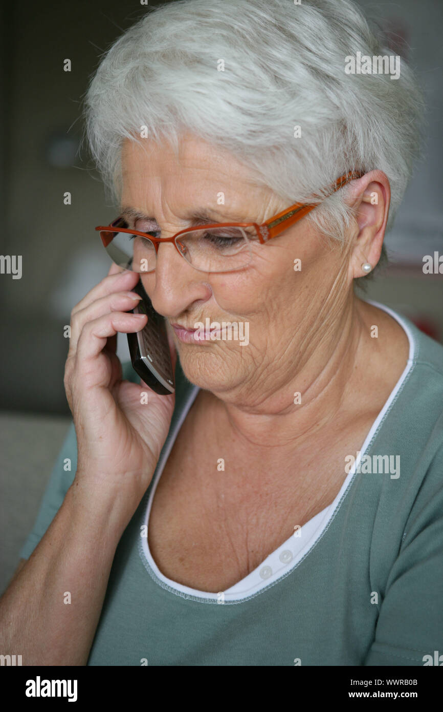 Old lady making phone call Stock Photo - Alamy
