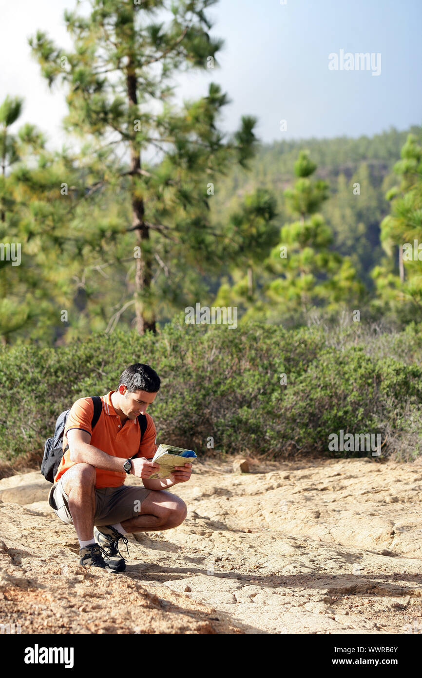 Hiker with a map Stock Photo - Alamy