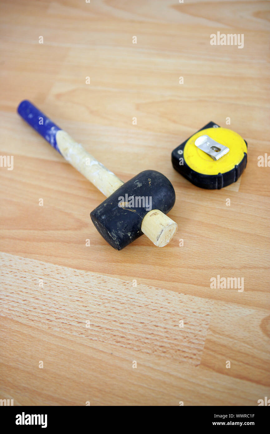 Mallet and retractable measure Stock Photo - Alamy