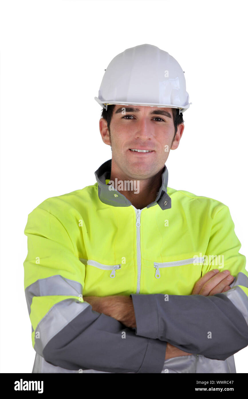 Man in a safety jacket and helmet Stock Photo - Alamy