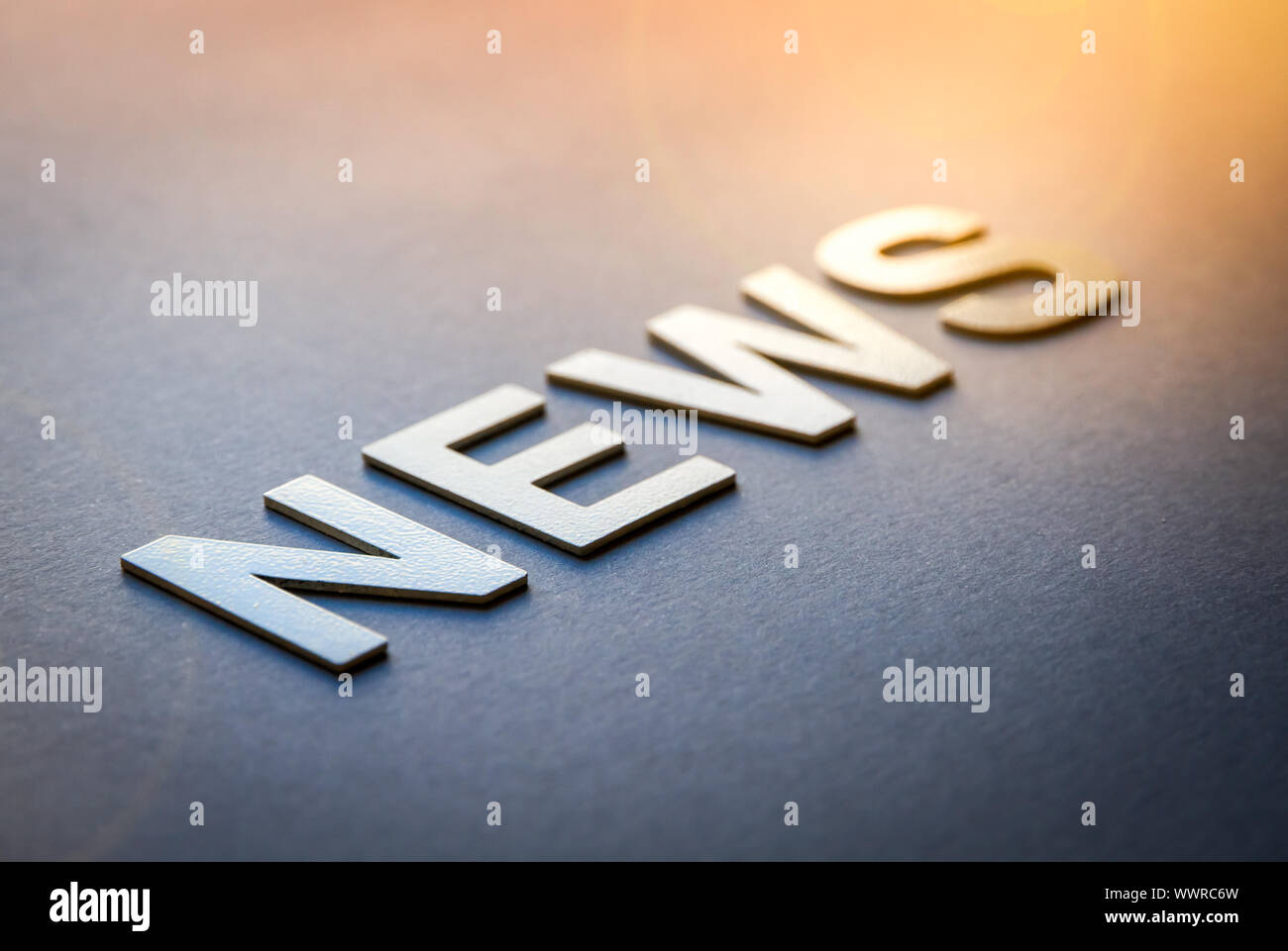 Word news written with white solid letters on a board Stock Photo - Alamy