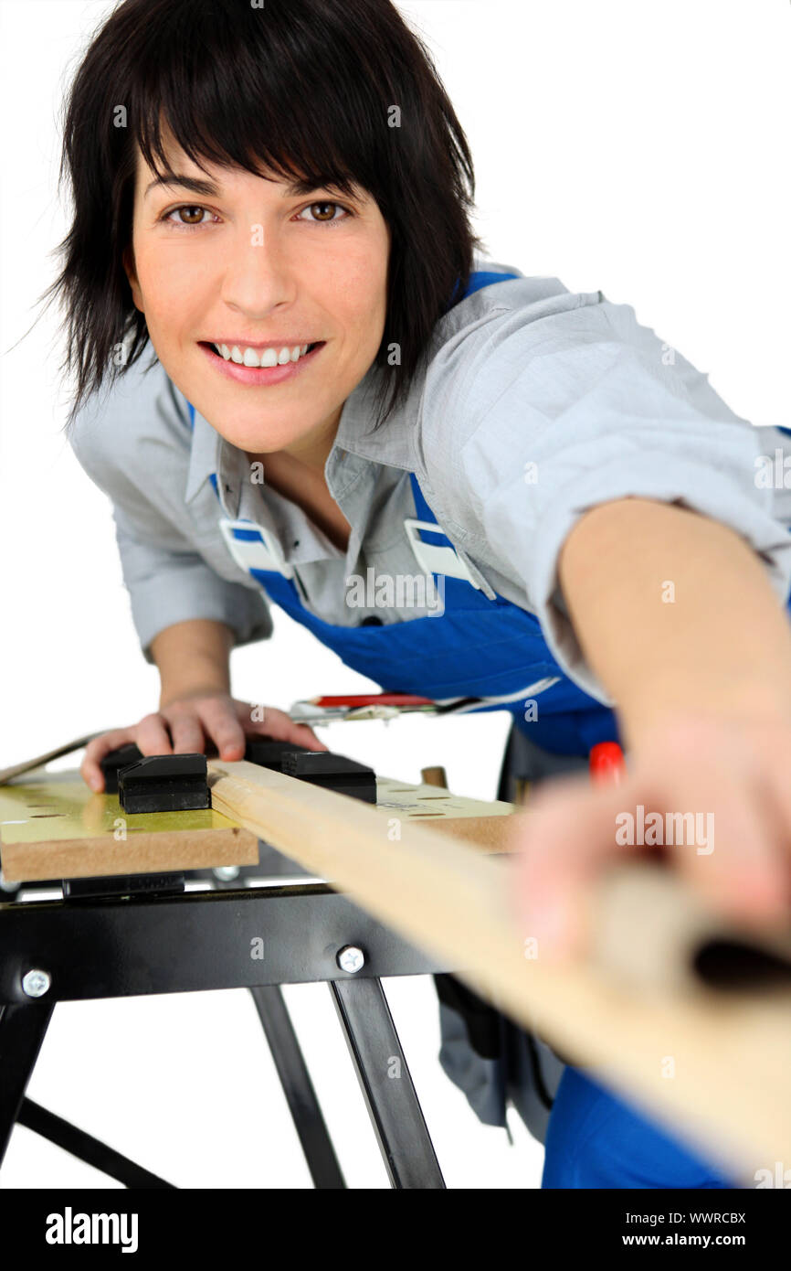 Female carpenter using workbench Stock Photo - Alamy
