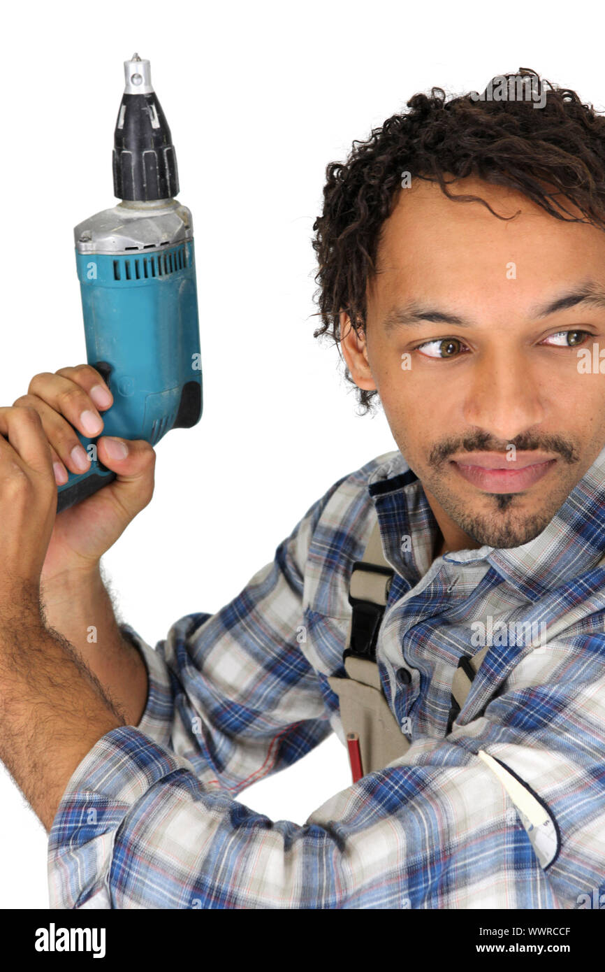Worker with an electric screwdriver Stock Photo - Alamy