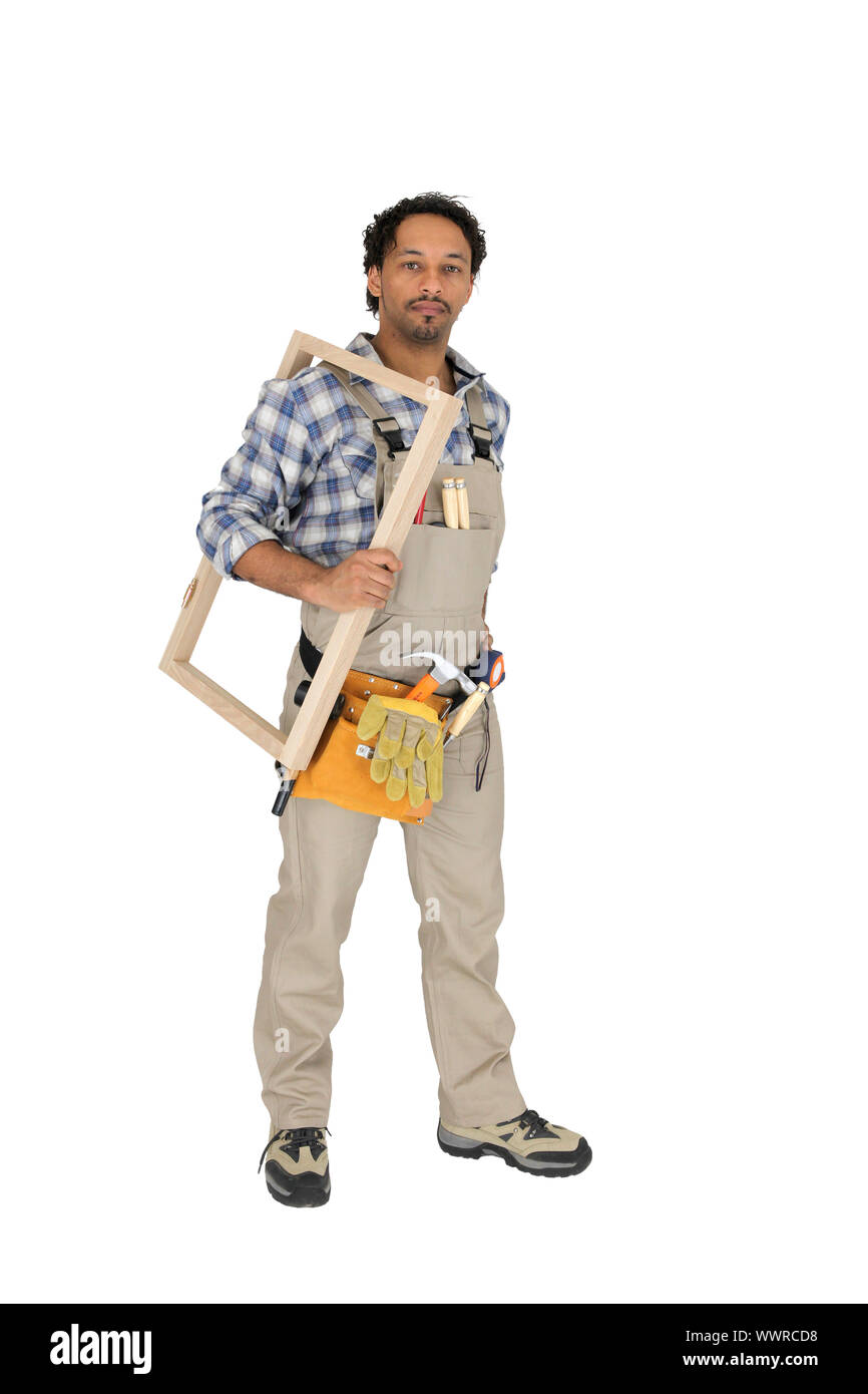 carpenter holding a window frame Stock Photo - Alamy