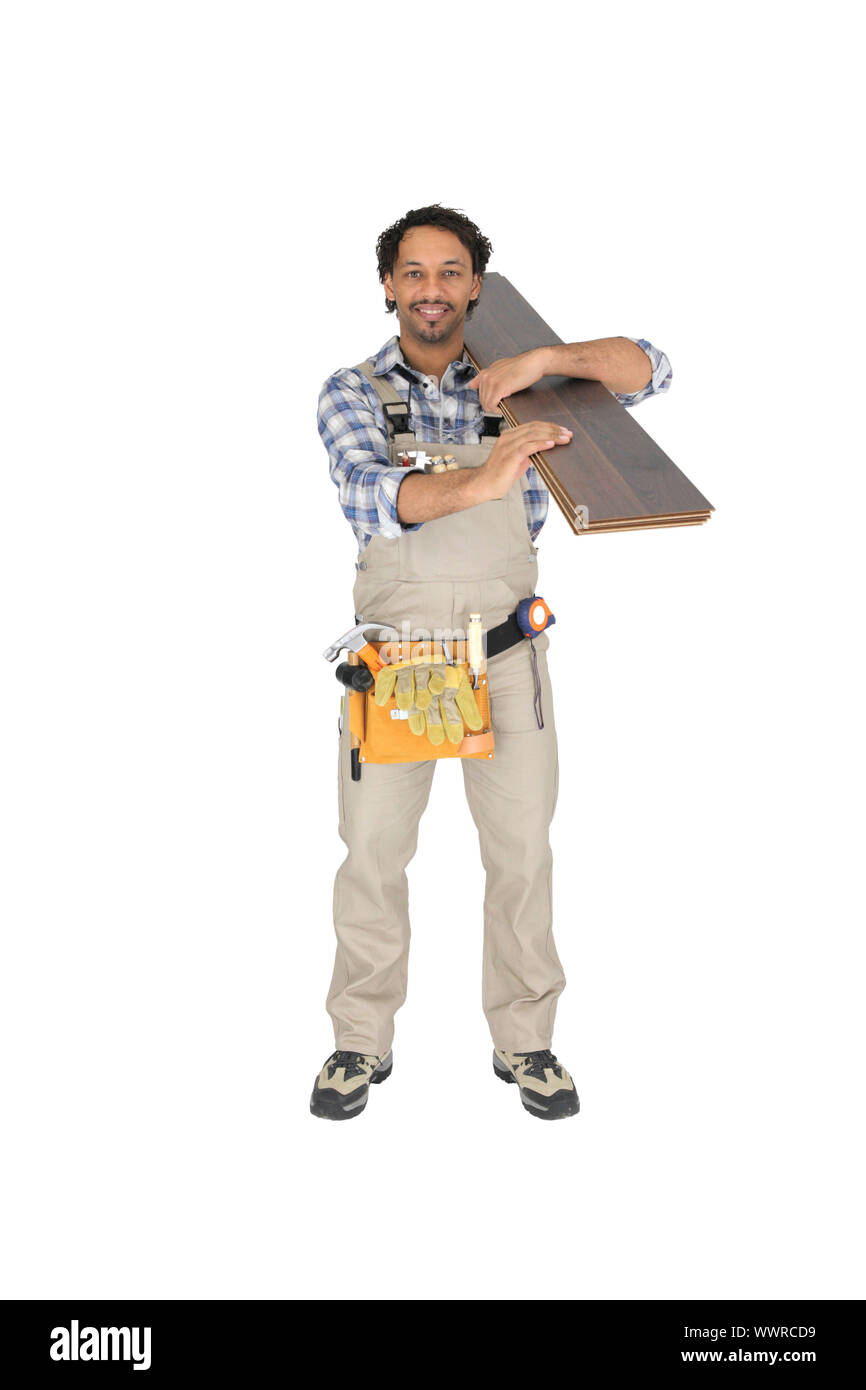 Labourer carrying plywood Stock Photo - Alamy