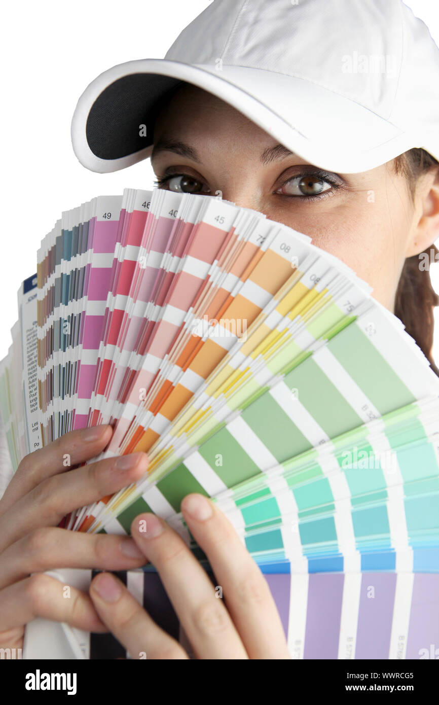 female painter hiding her face up to eyes with color chart Stock Photo ...