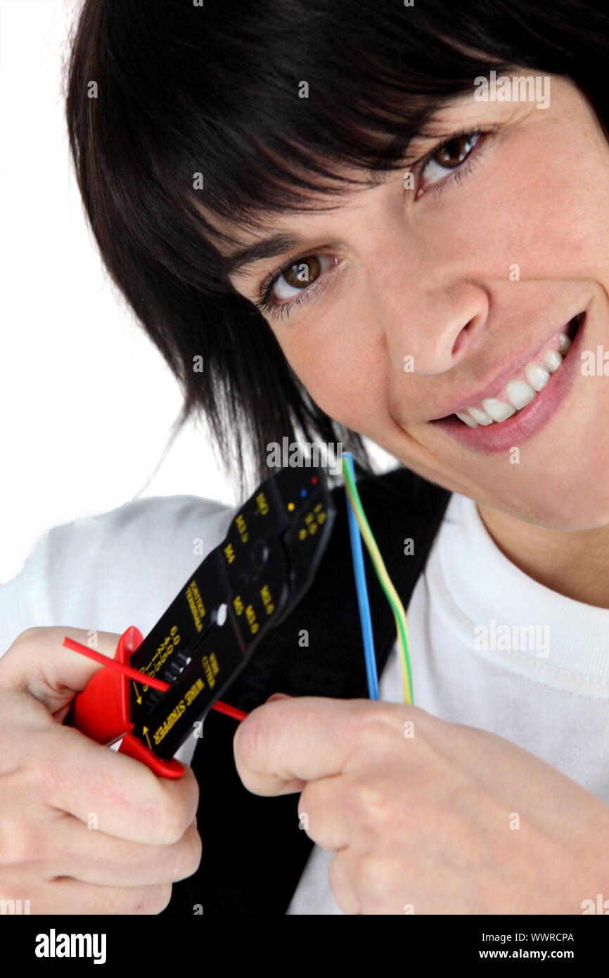 Woman cutting wire with special tool Stock Photo - Alamy