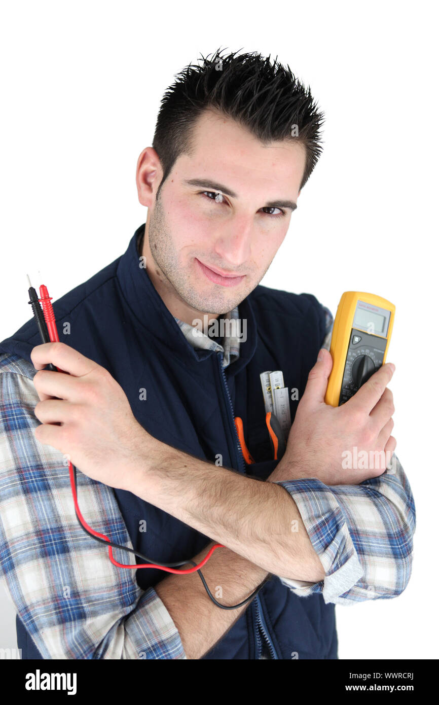 Electrician with a multimeter Stock Photo - Alamy