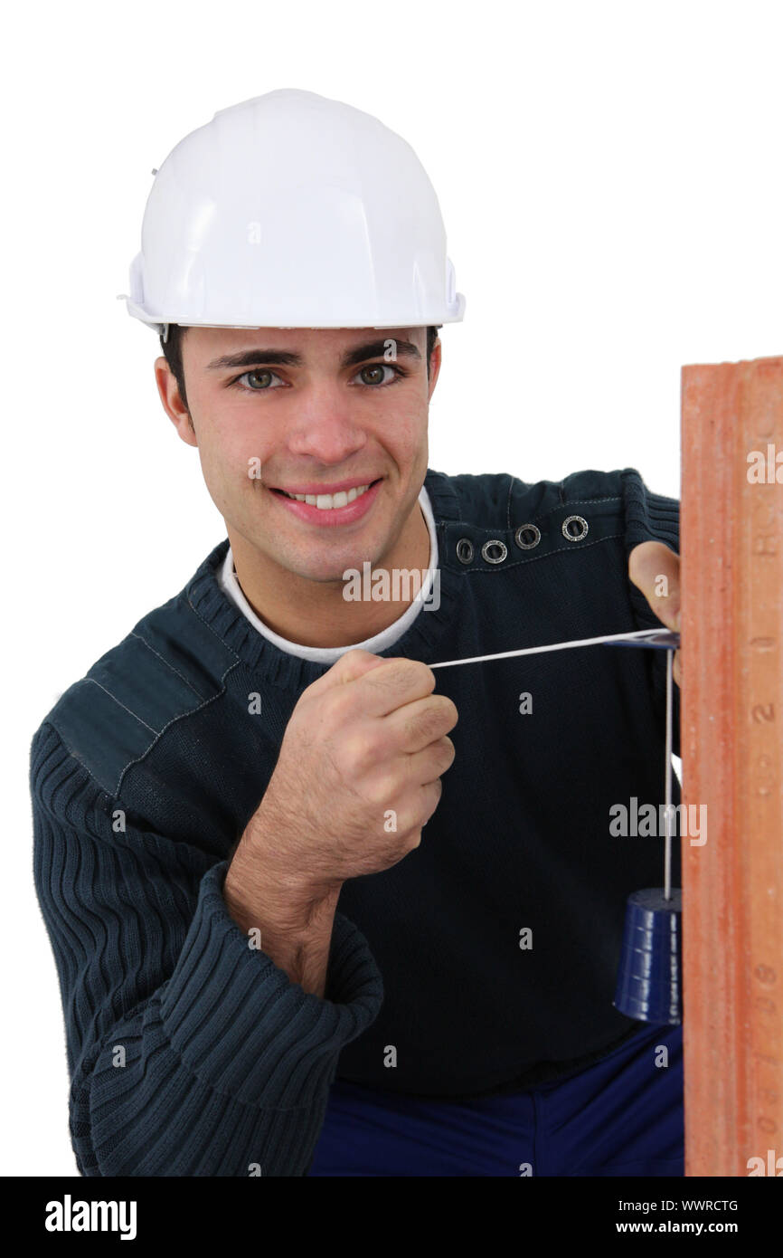Mason with plumb line hi-res stock photography and images - Alamy