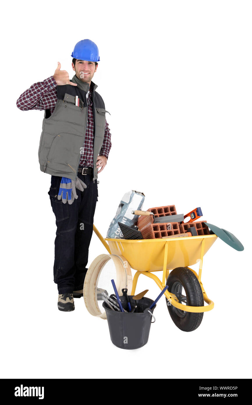 Bricklayer suggesting you call him Stock Photo - Alamy