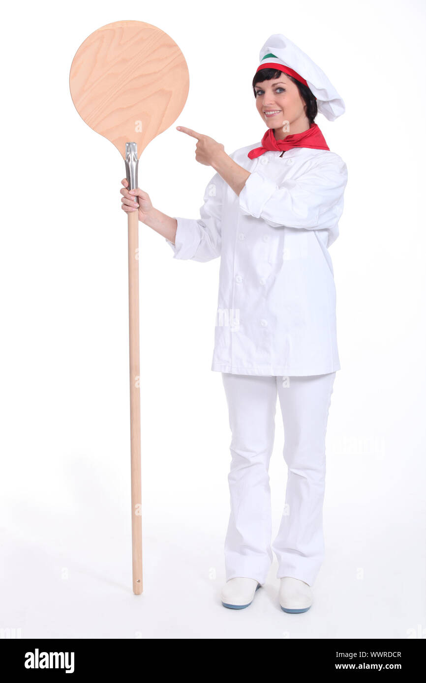 Female pizza chef with a wooden peel Stock Photo - Alamy