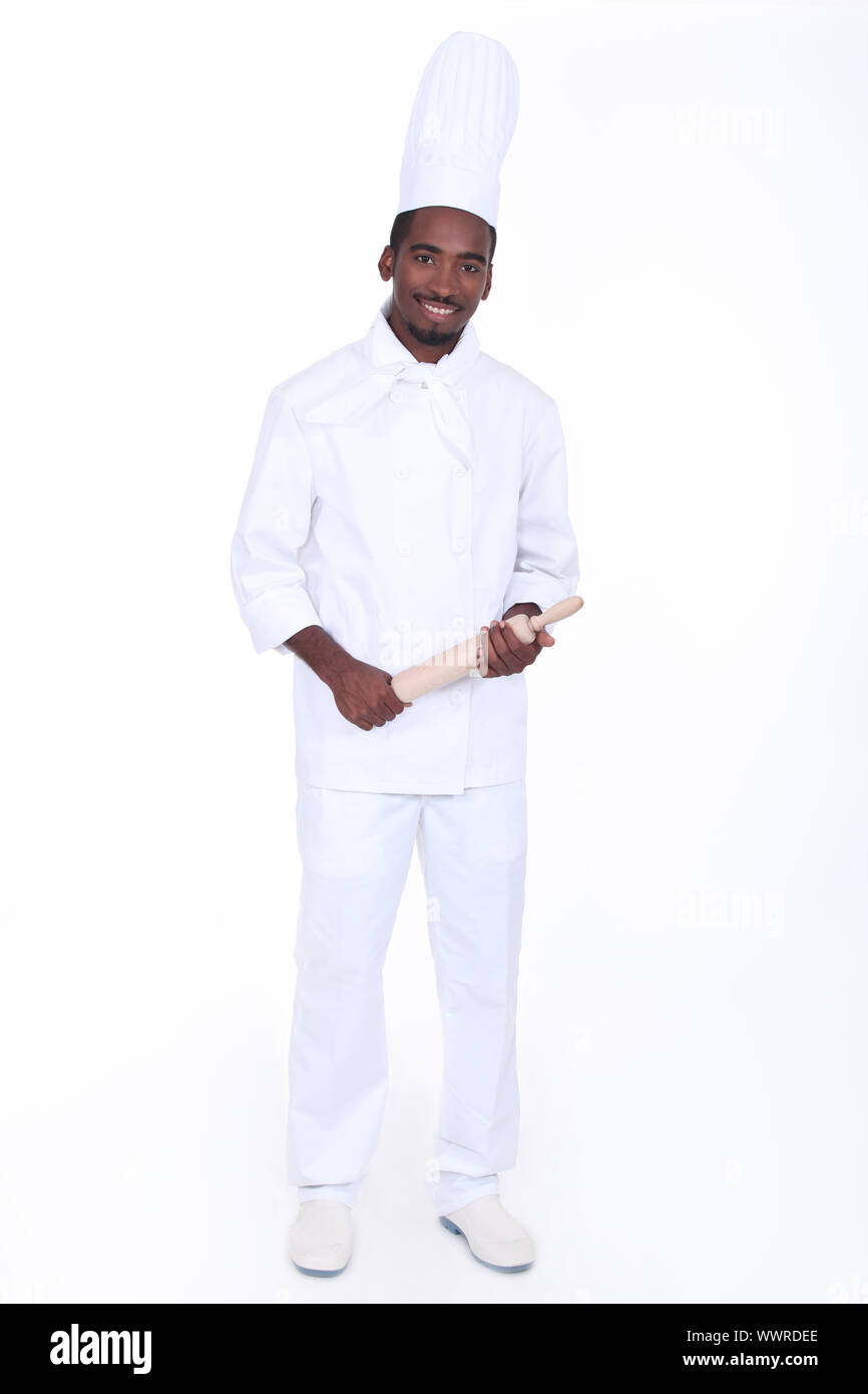 Happy male chef holding rolling pin Stock Photo - Alamy