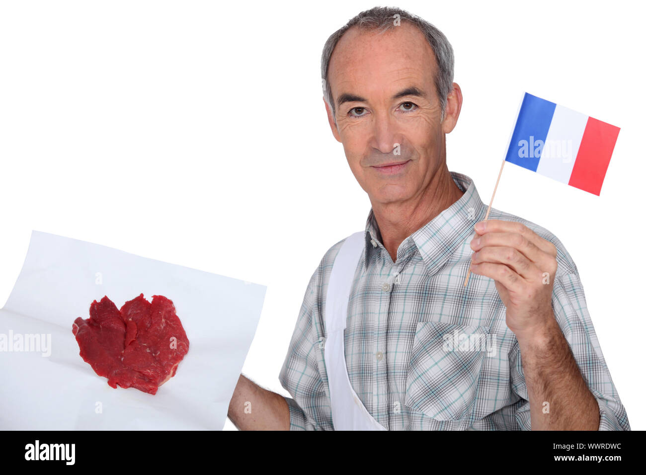Butcher showing French safe meat Stock Photo - Alamy