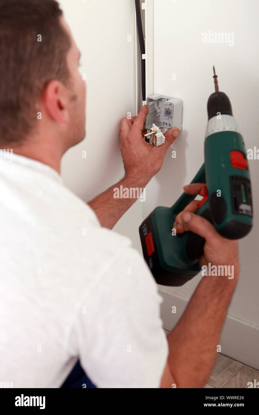 portrait of a man drilling Stock Photo - Alamy