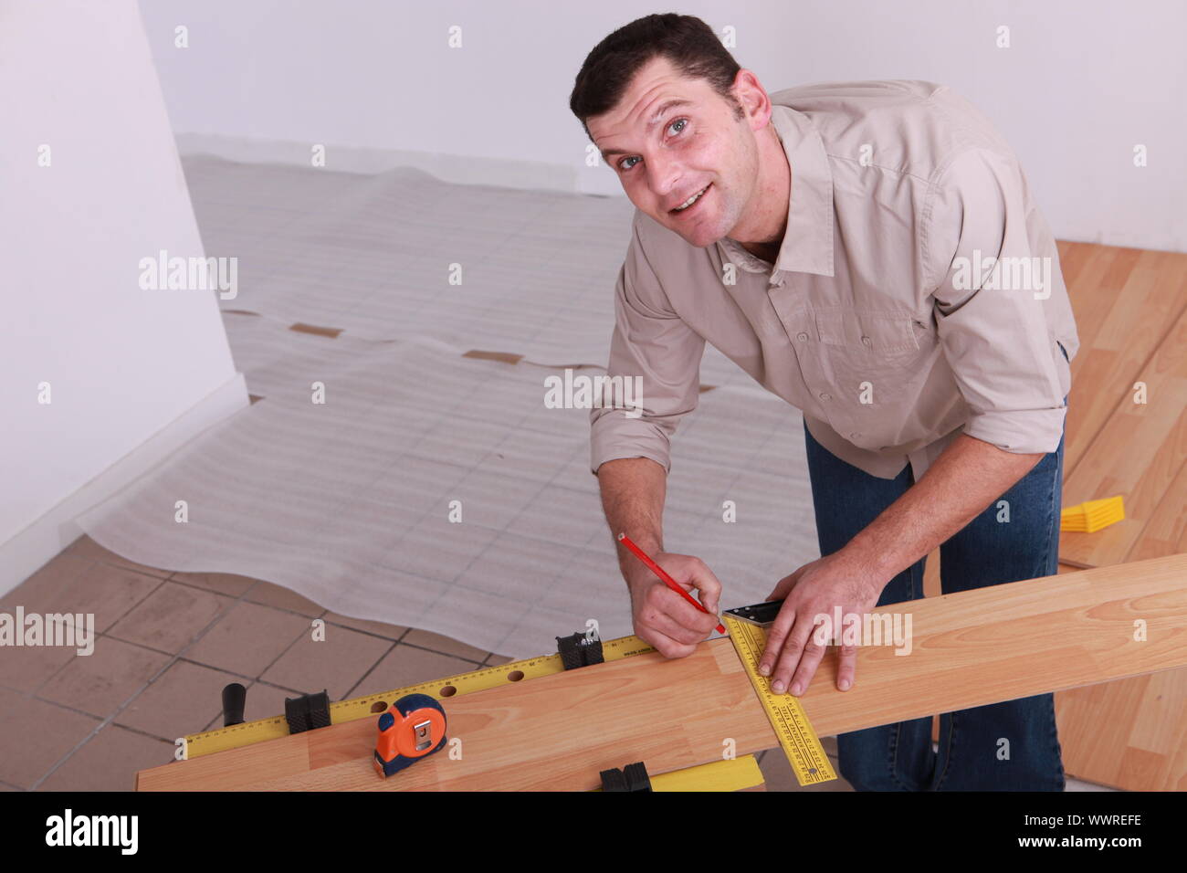 Parquet layer working Stock Photo - Alamy