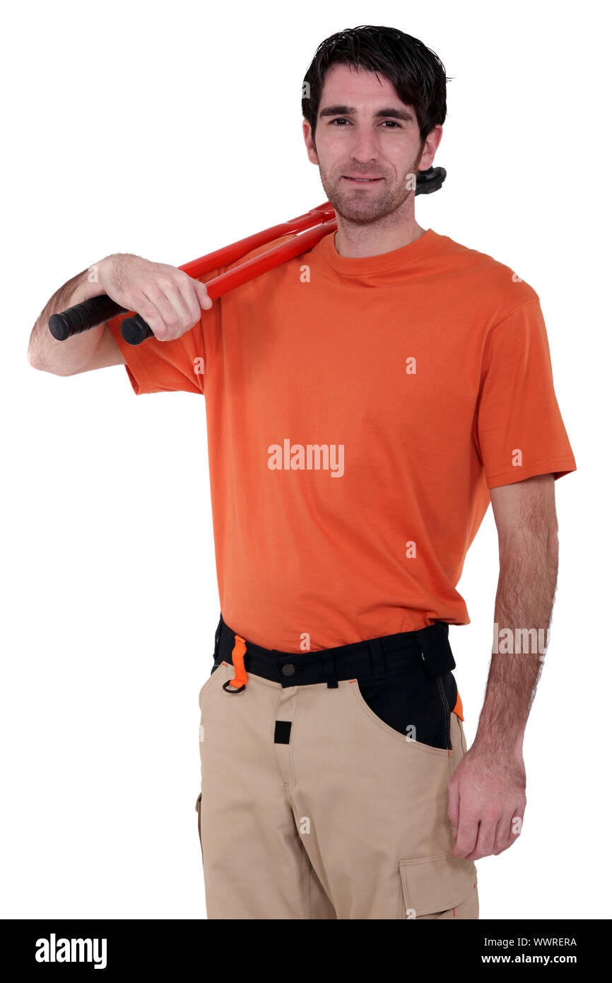 Craftsman with tool on shoulder Stock Photo - Alamy