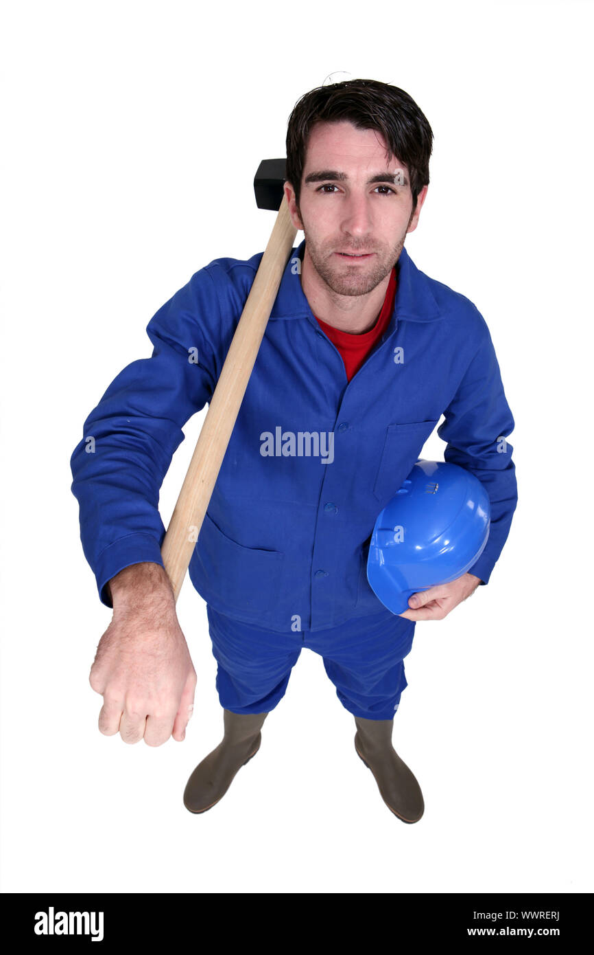 Man posing with sledge-hammer over shoulder Stock Photo - Alamy