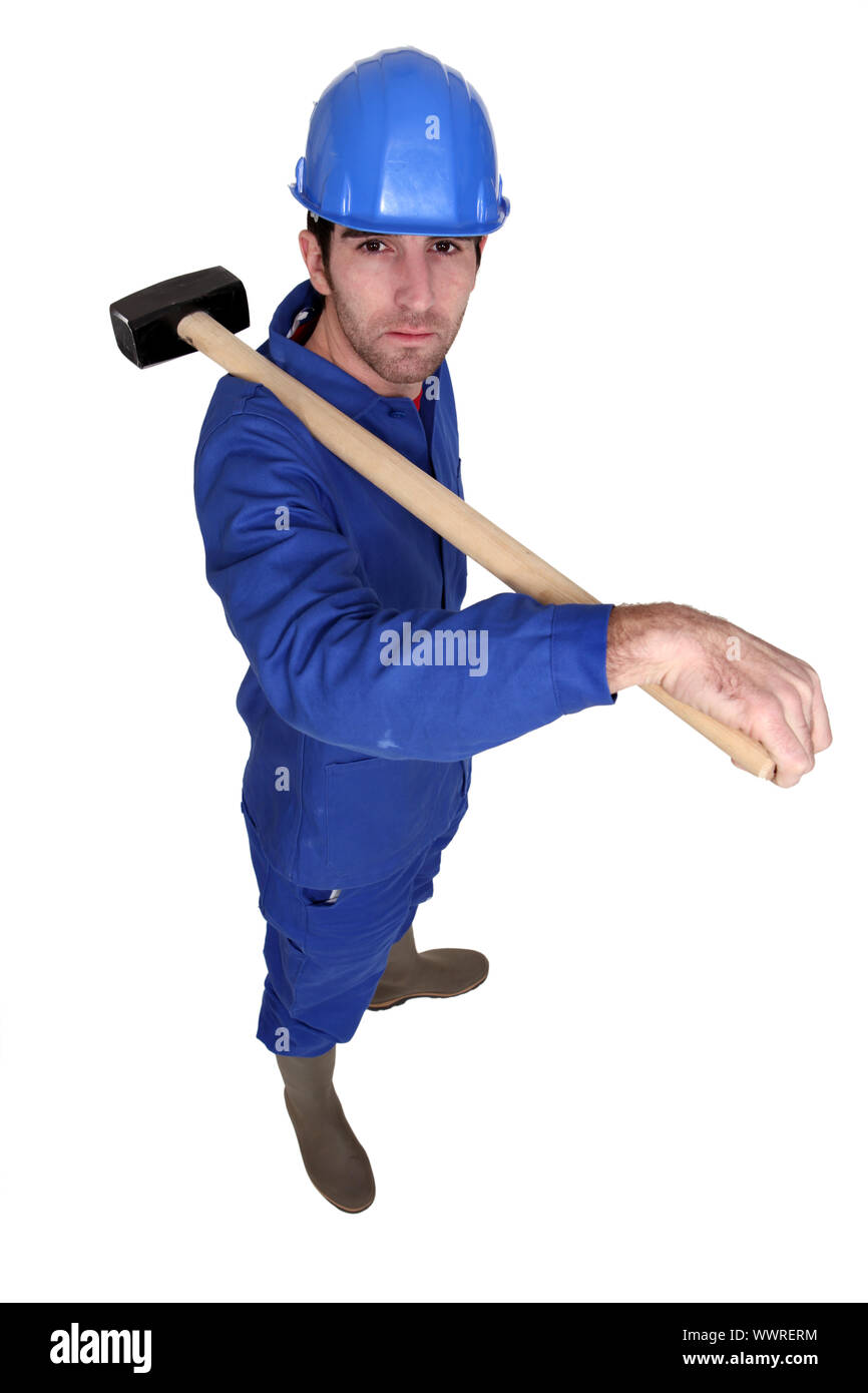 Man carrying sledge hammer Stock Photo - Alamy